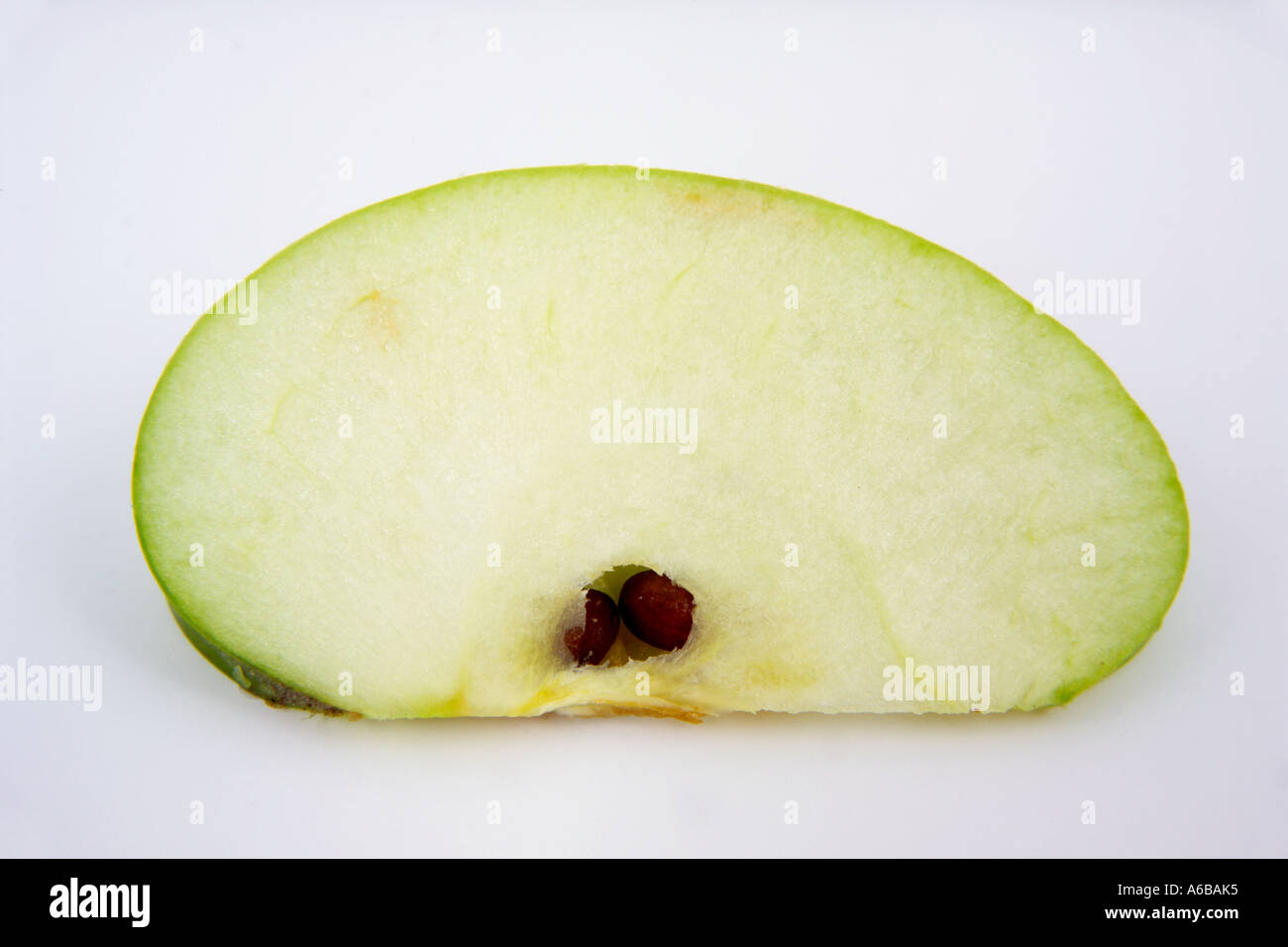 slice of a granny smith apple Stock Photo - Alamy