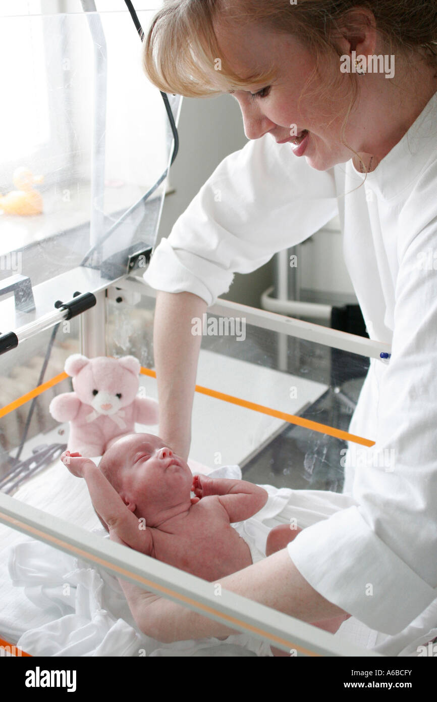 woman doctor with newborn baby Stock Photo - Alamy