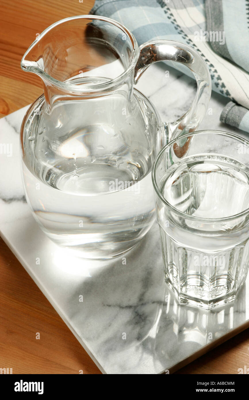 Pitcher and glass with water Stock Photo - Alamy