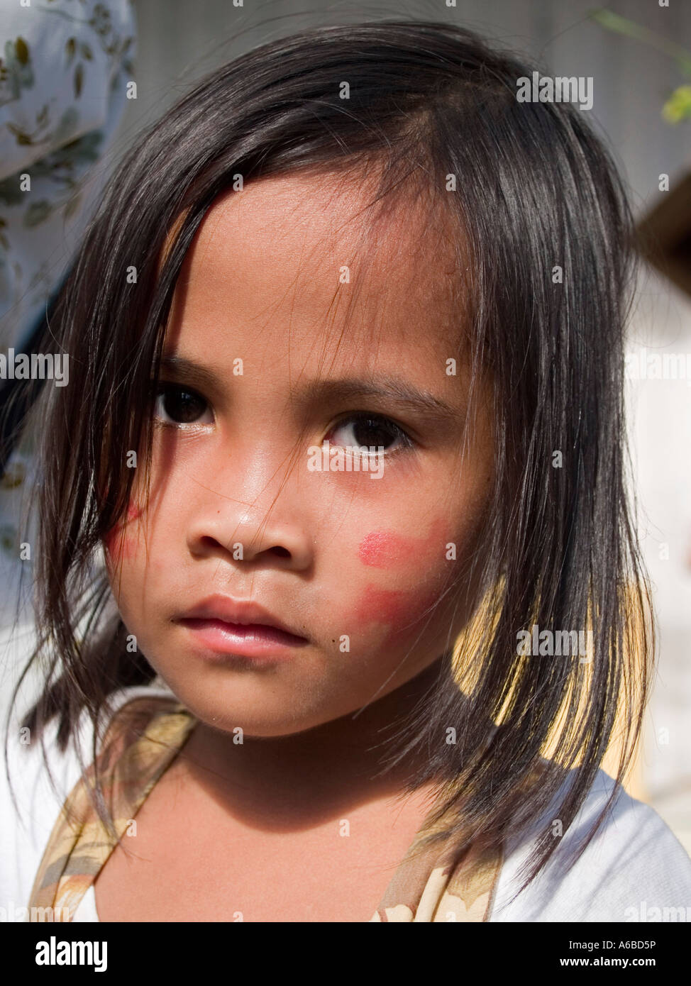 Young girl with dab of face paint at Ati Atihan Festival Philippines ...