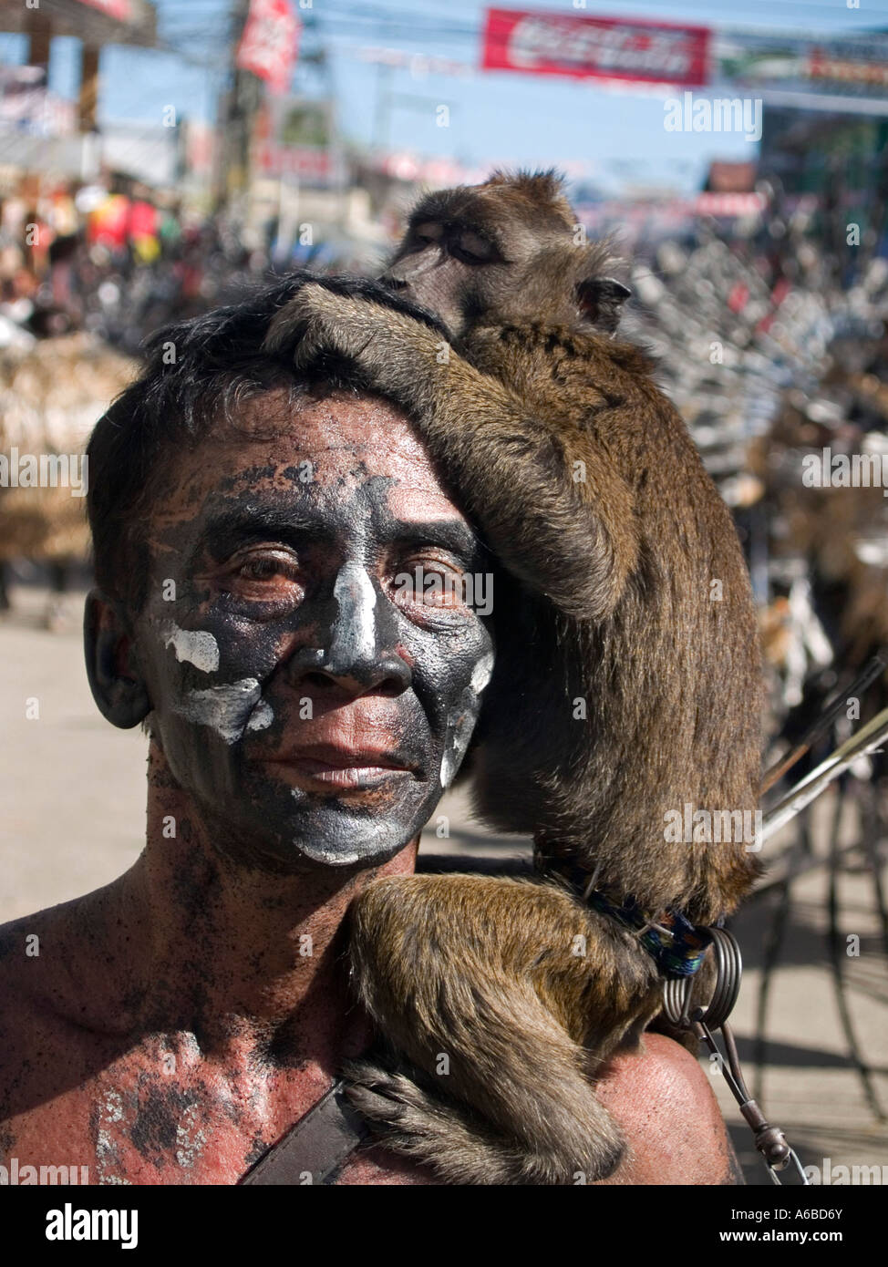 Man and his monkey Ati Atihan Festival Philippines Stock Photo - Alamy