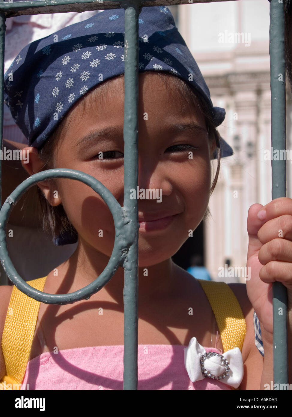 Girl behind a gate watching Ati Atihan Festival Philippines Stock Photo ...