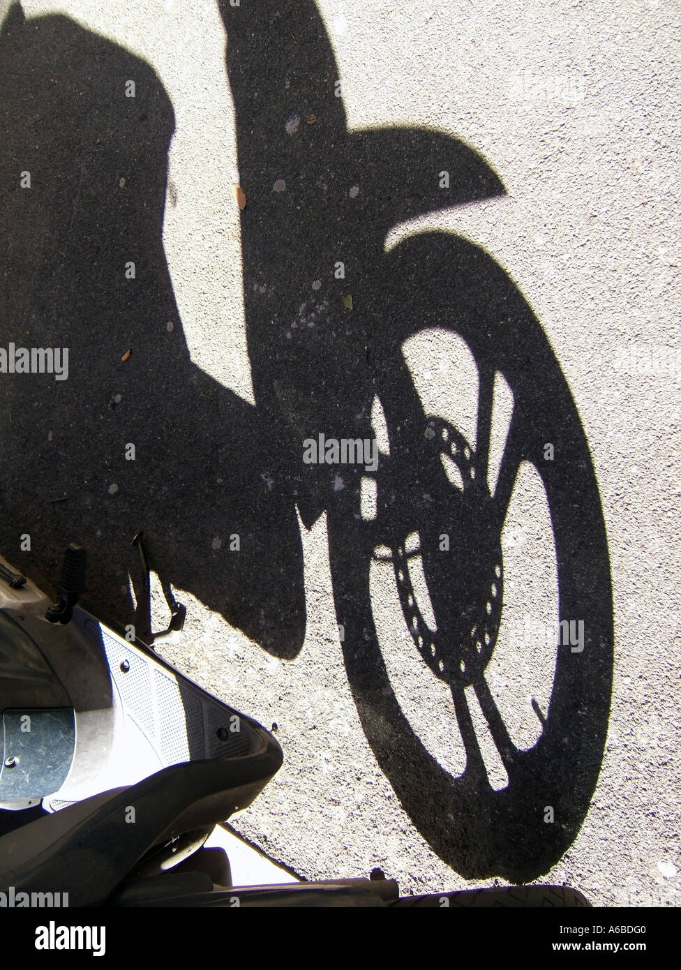 motorbike shadow on sidewalk Stock Photo - Alamy