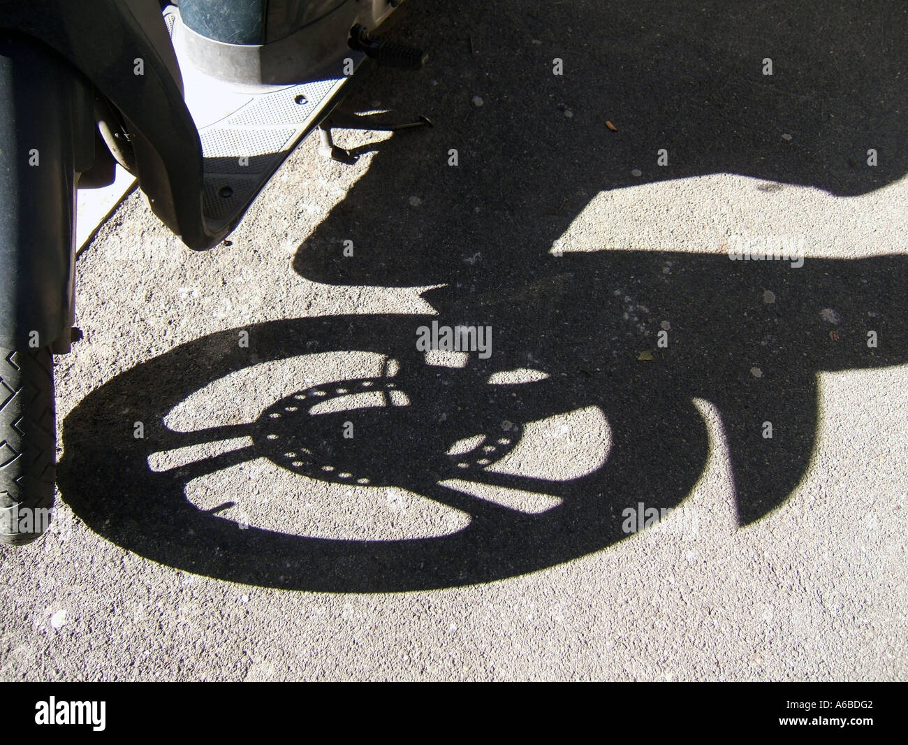 motorbike shadow on sidewalk Stock Photo - Alamy