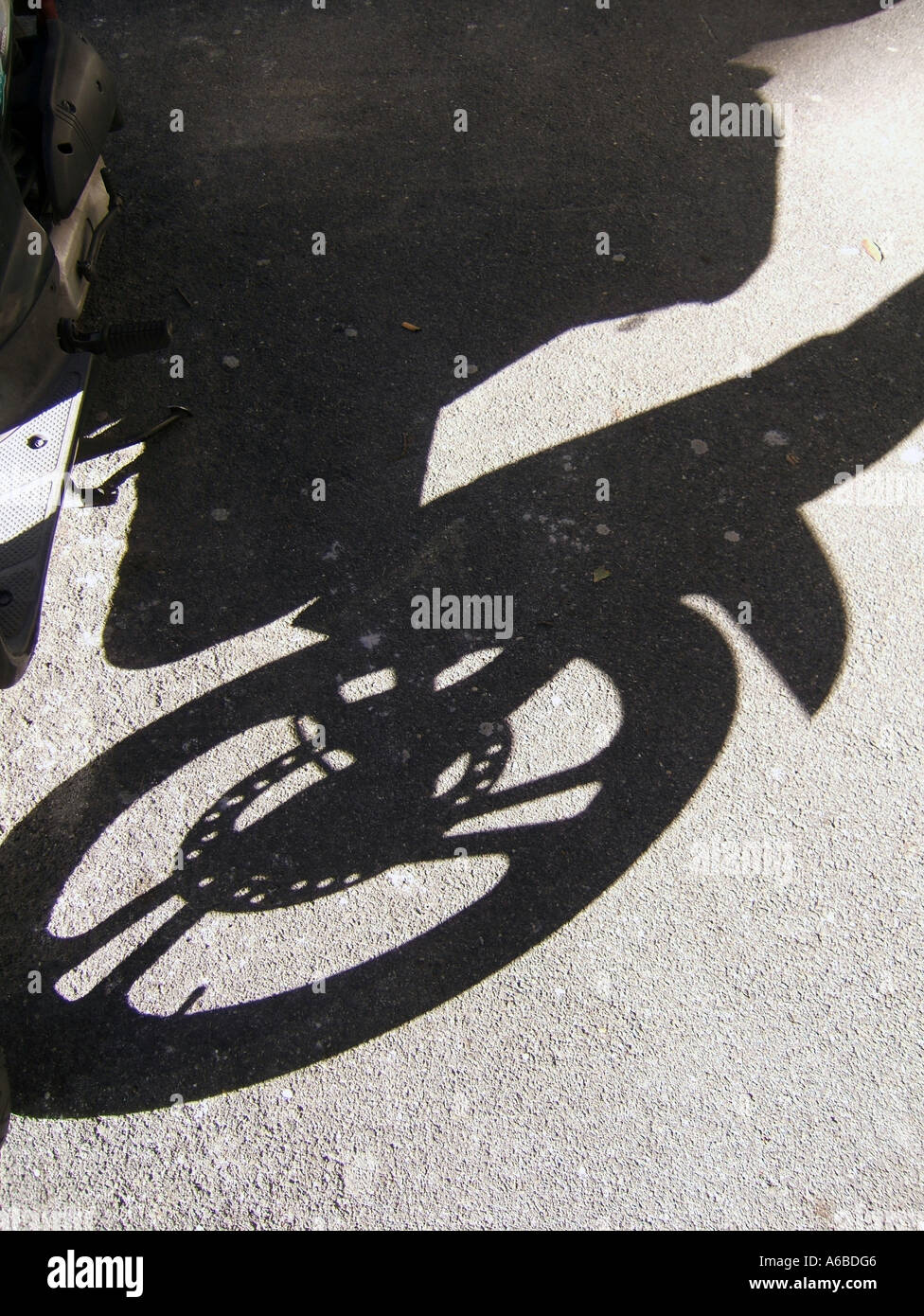 motorbike shadow on sidewalk Stock Photo - Alamy
