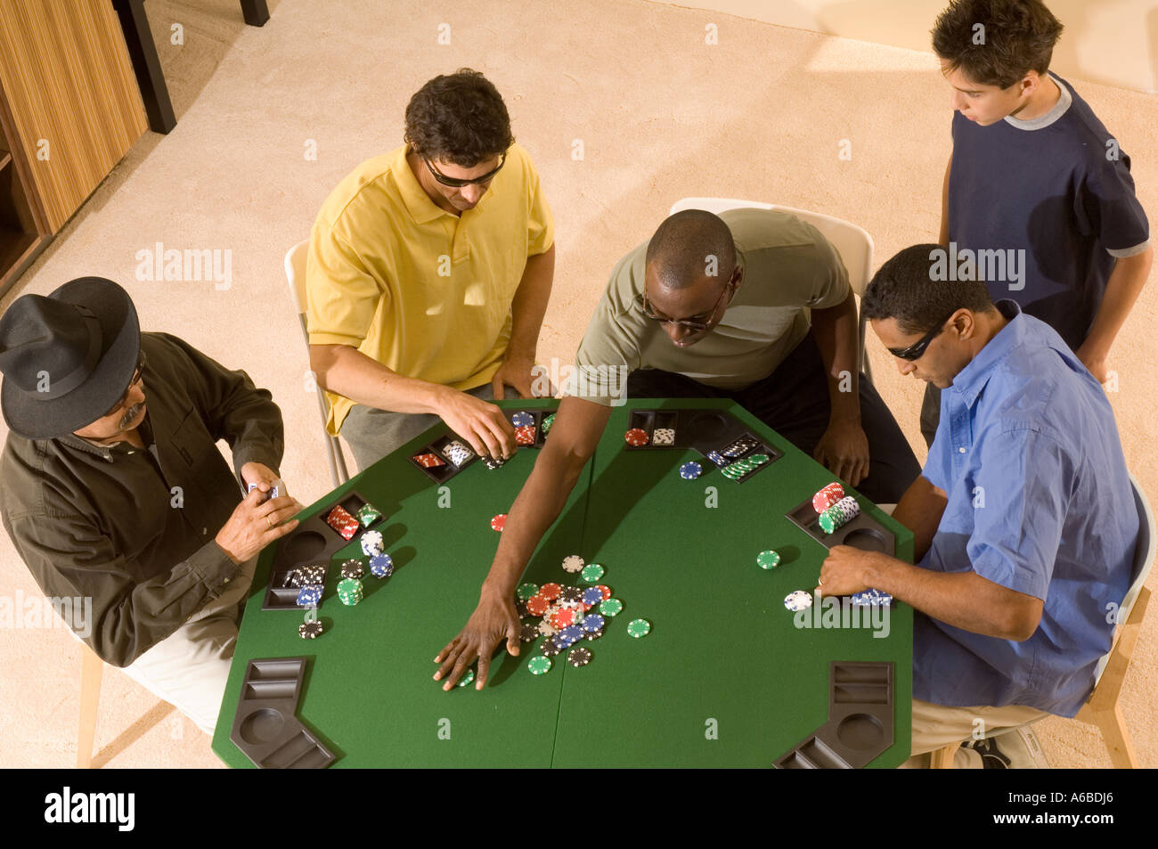 Portrait of men gambling Stock Photo - Alamy
