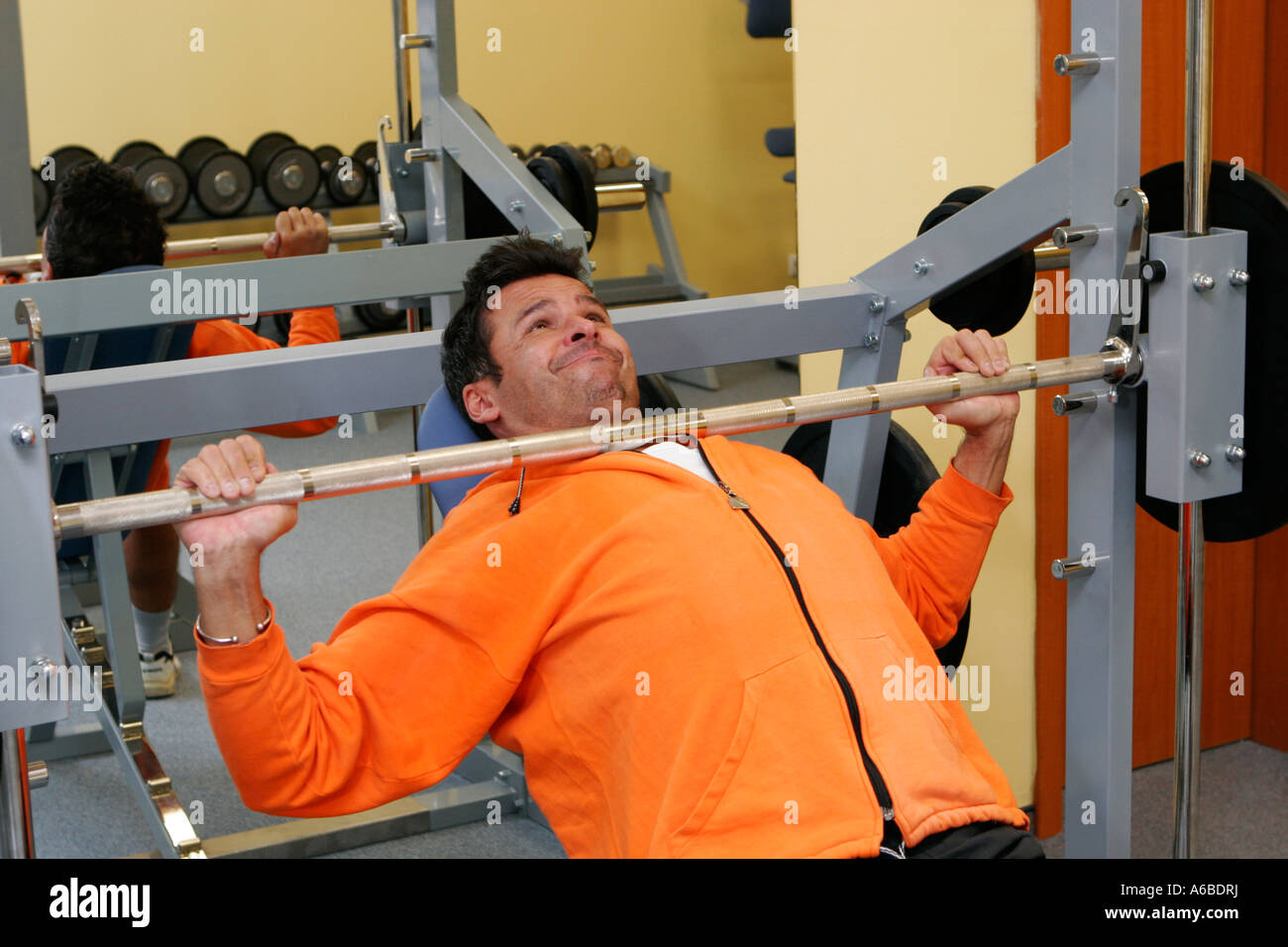 Man Exercise in Fitness Studio Stock Photo - Alamy