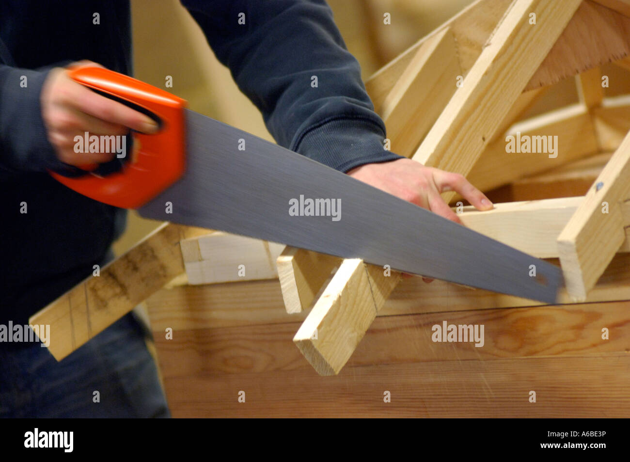 British carpenter sawing timber frame construction London UK Stock ...