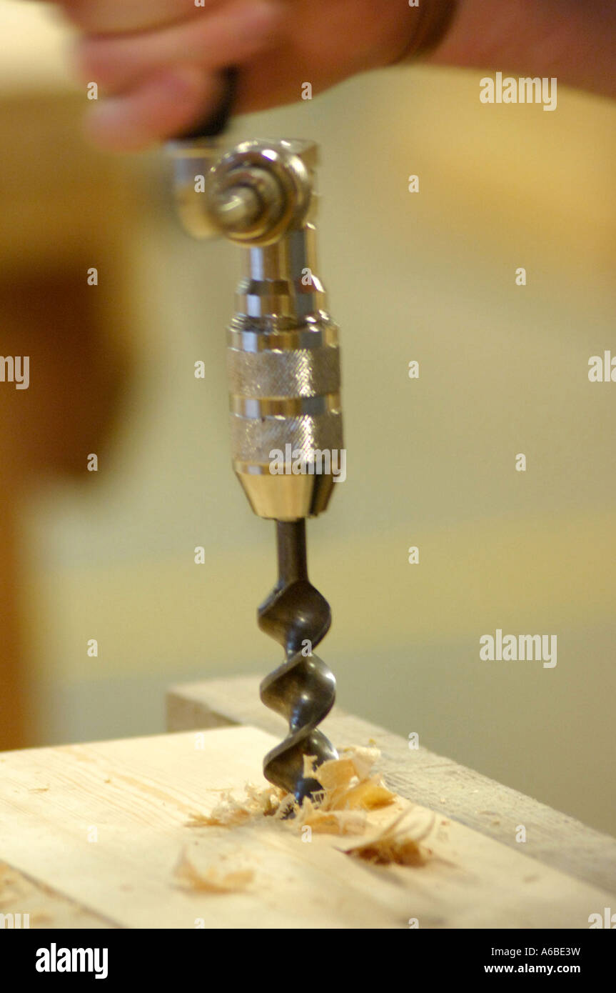British carpenter drilling working with wood London UK Stock Photo - Alamy