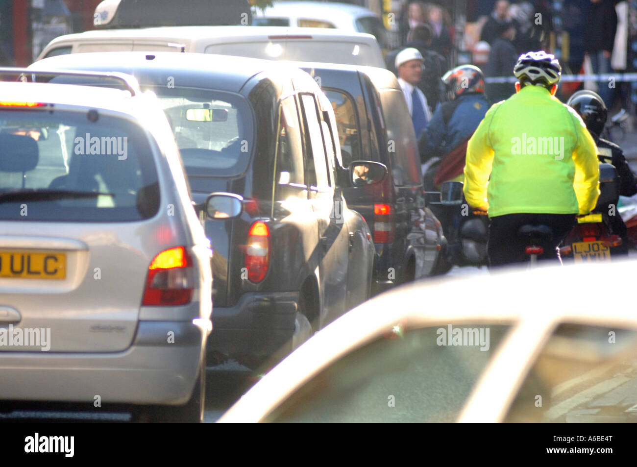 British business man cycling to work in London rush hour UK Stock Photo ...