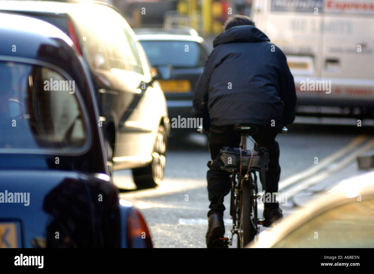 British business man cycling to work in London rush hour UK Stock Photo ...