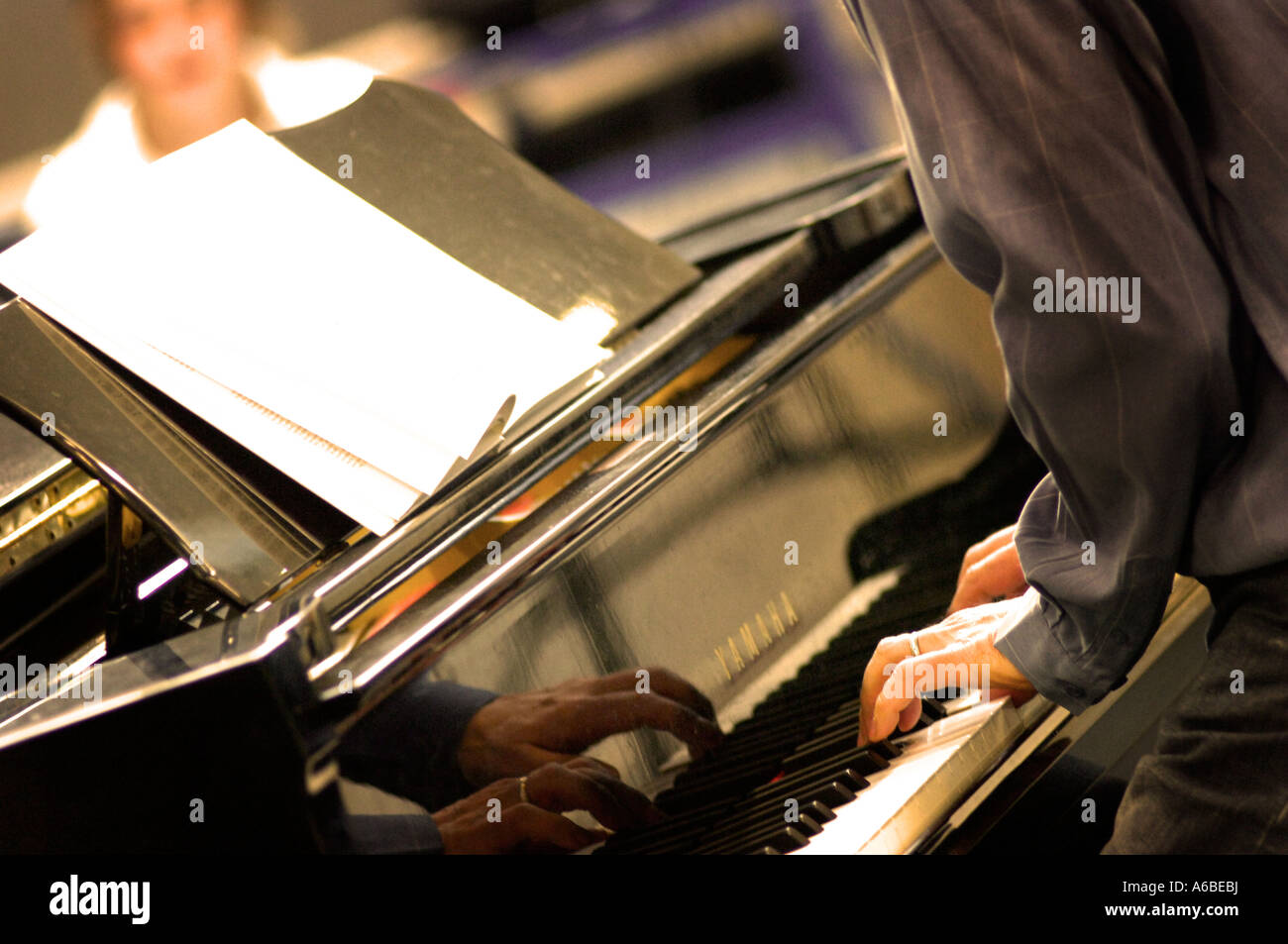 British music teacher playing piano London UK Stock Photo - Alamy