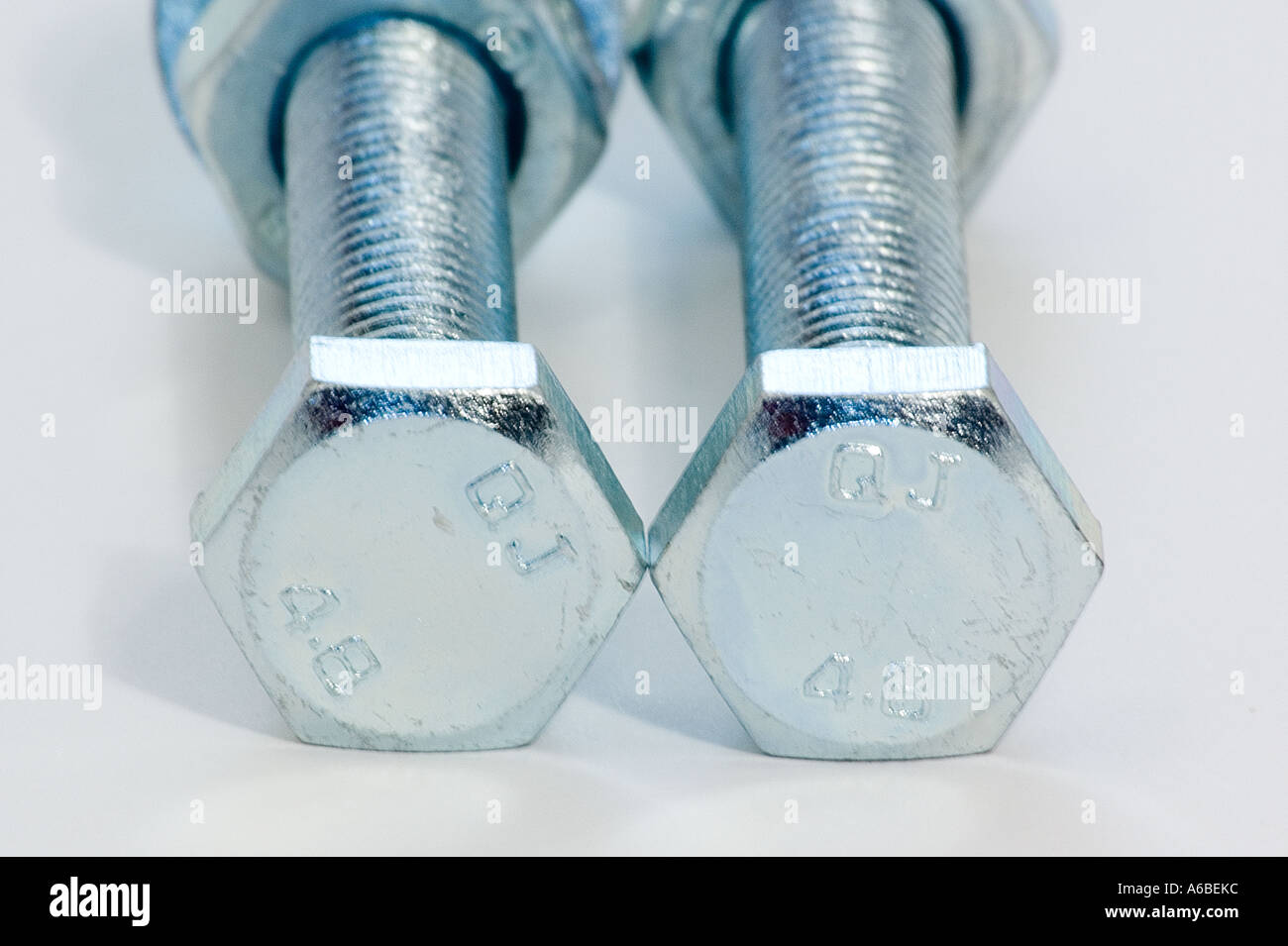 Pair of bolts with nuts Stock Photo - Alamy