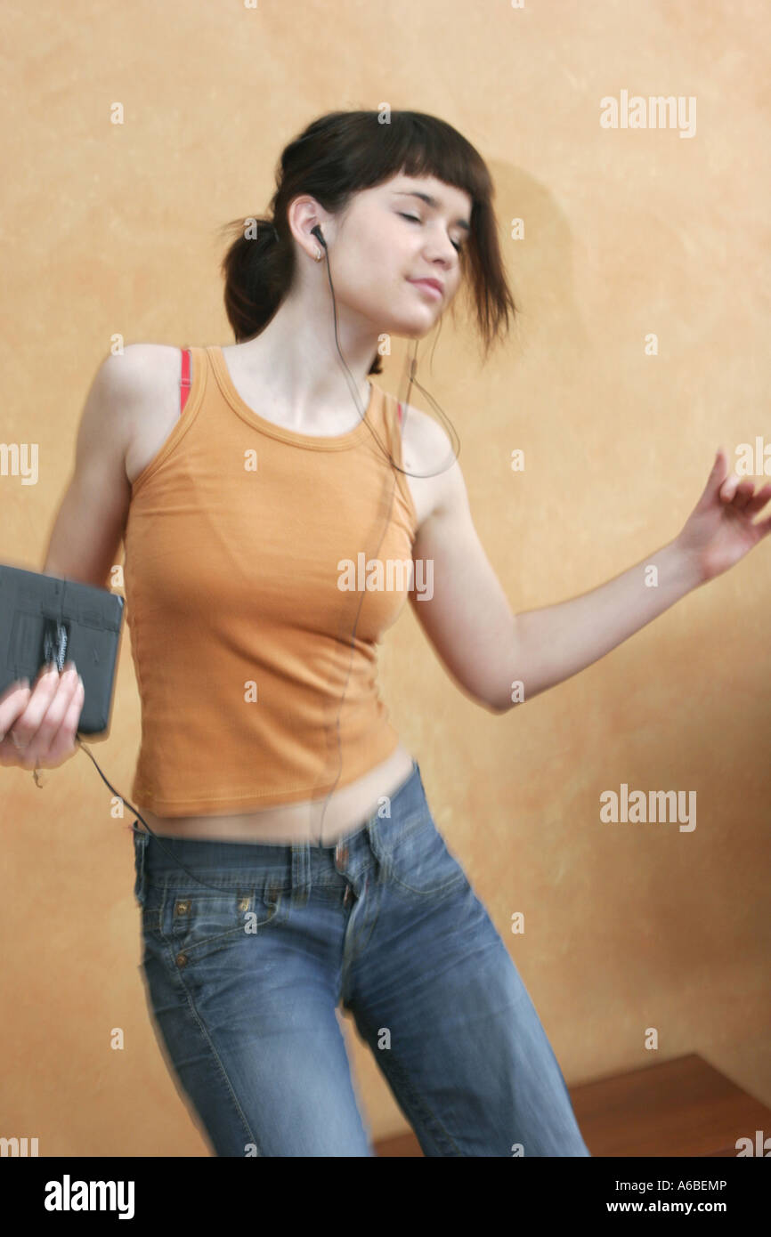 teenage girl dancing to music Stock Photo - Alamy