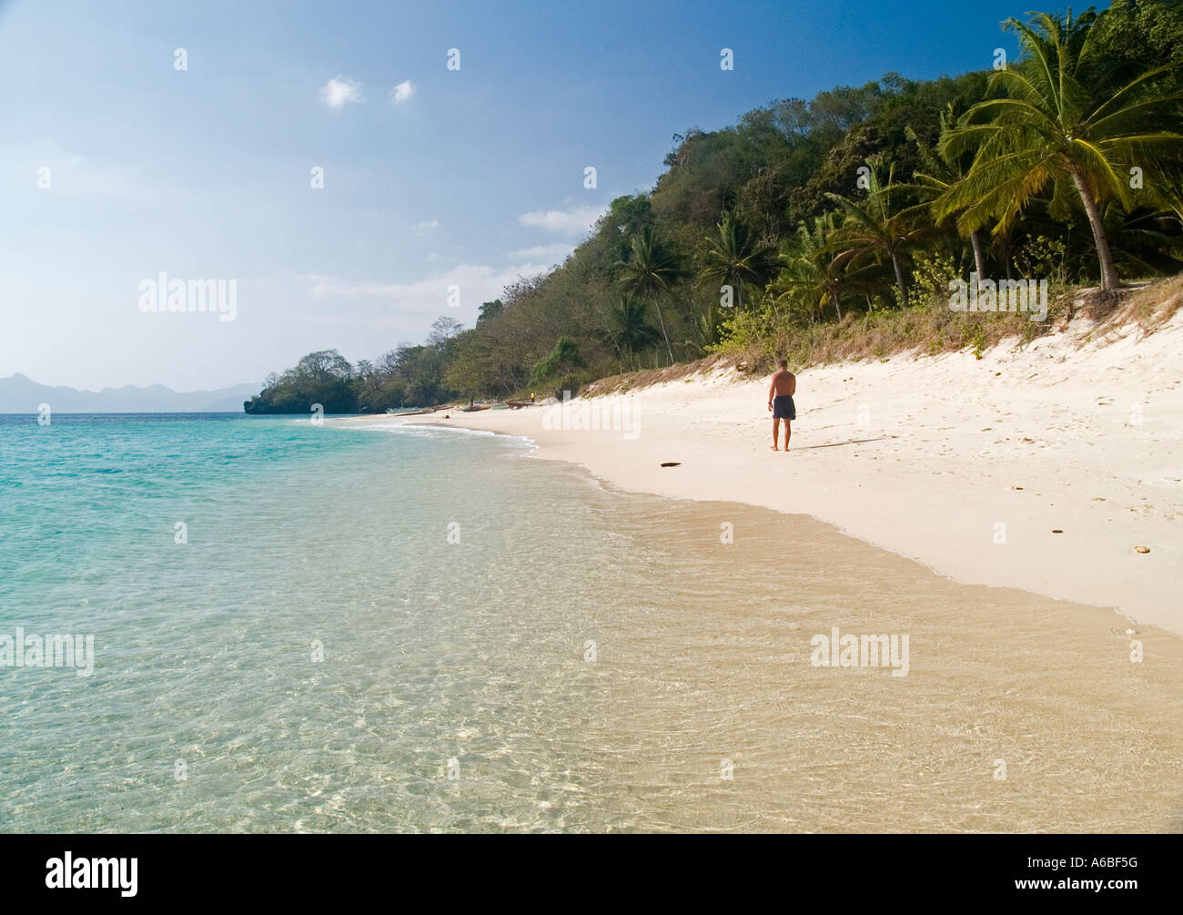 solo beach bum, bather with a beach to himself Bacuit Archiplelago ...
