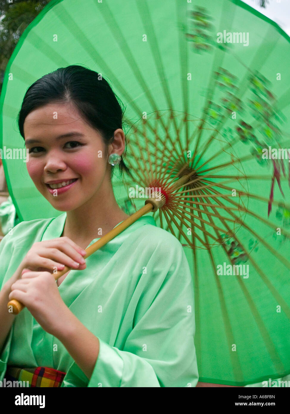 Young woman in kimono twirling her parasol Sinulog Festival Philippines ...