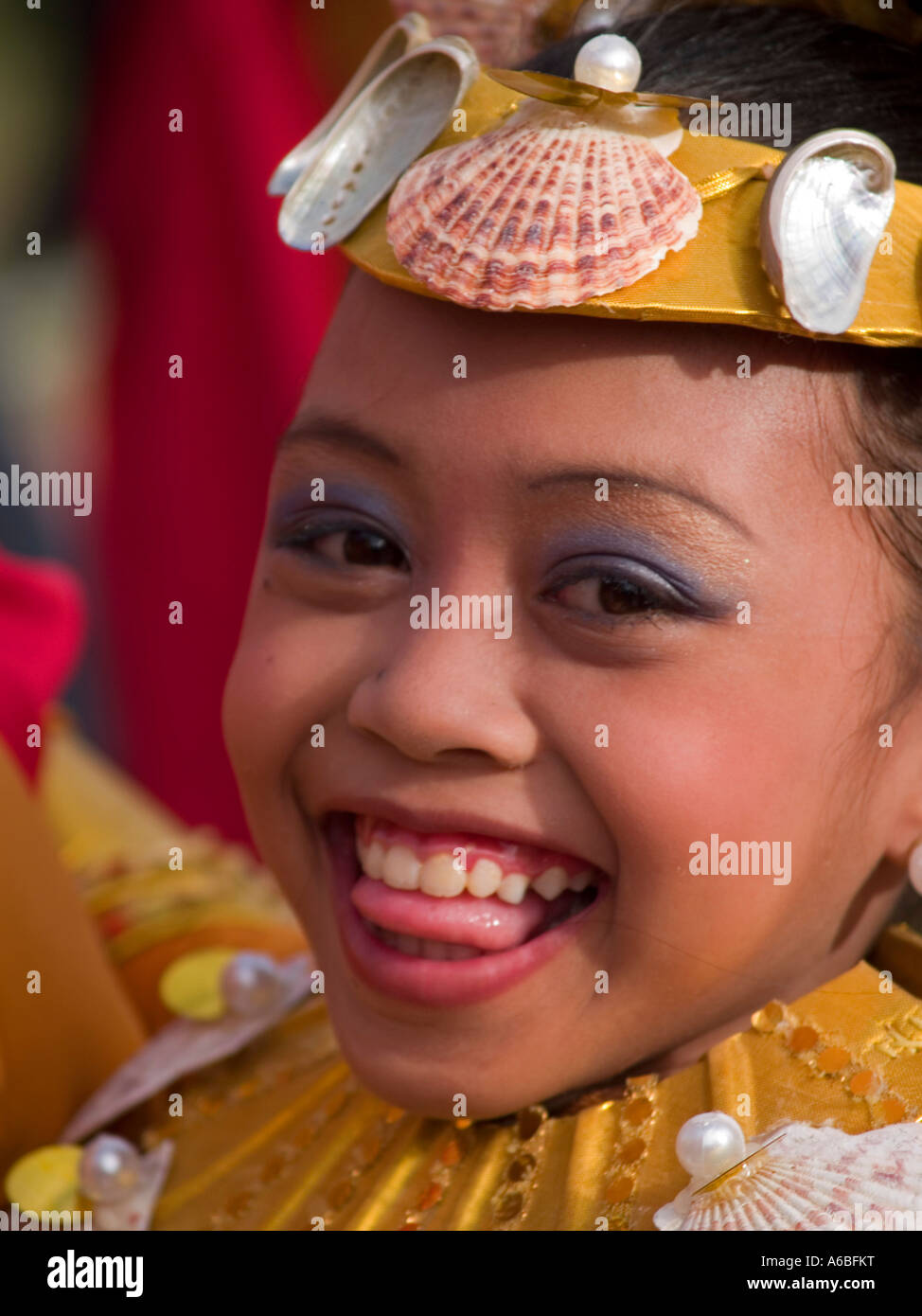 young girl with shell hat laughing at the Sinulog Festival Cebu ...