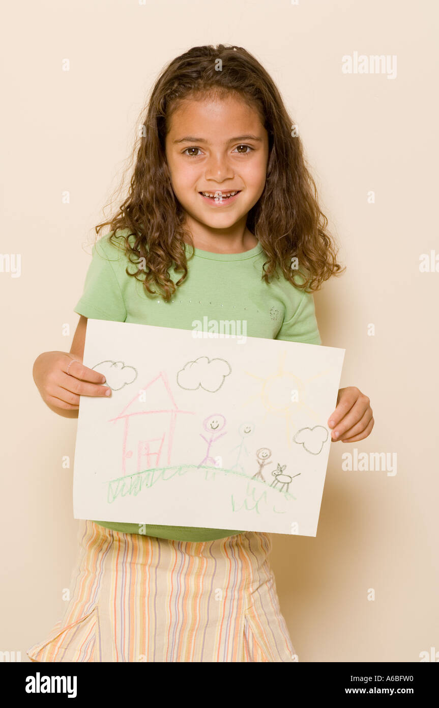 Portrait of Hispanic girl with drawing Stock Photo - Alamy