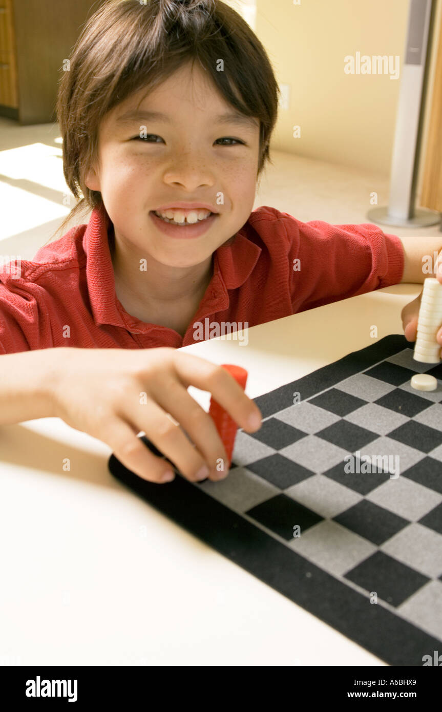Portrait of Asian boy playing checkers Stock Photo - Alamy
