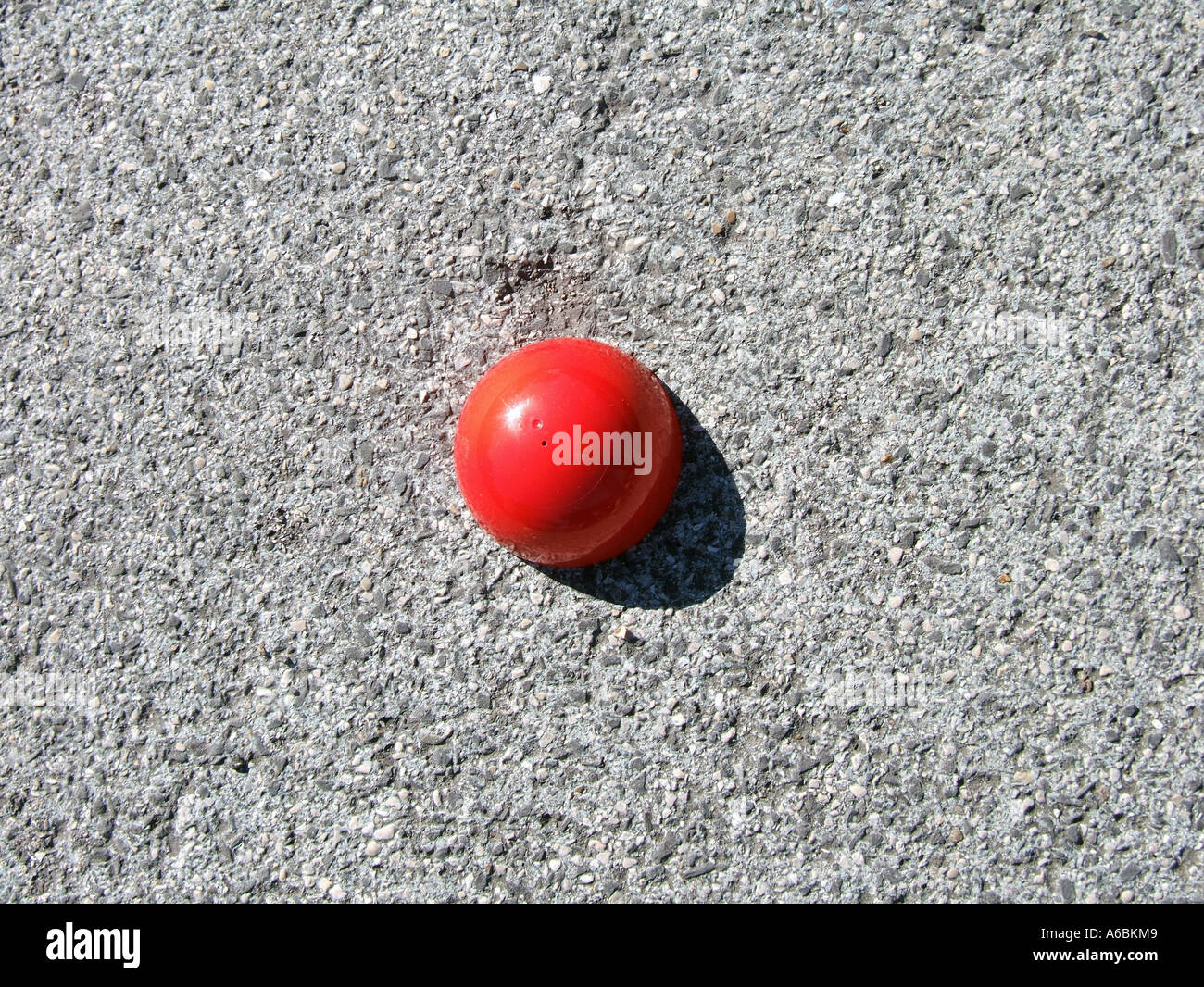 red skittle on road Stock Photo - Alamy