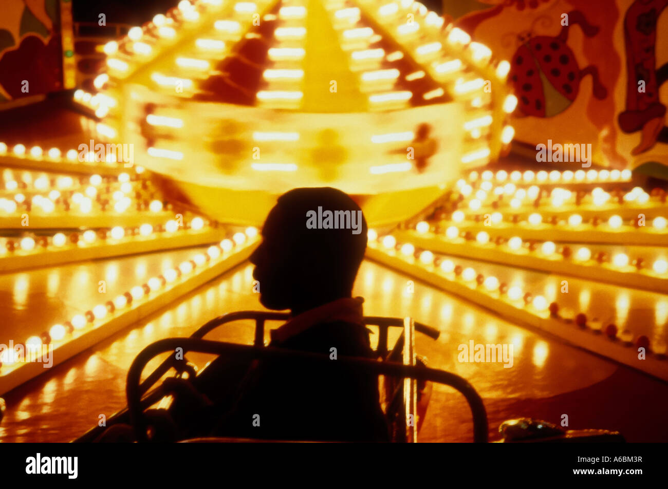 Young man rides the tilt a whirl at the Texas State Fair in Dallas ...
