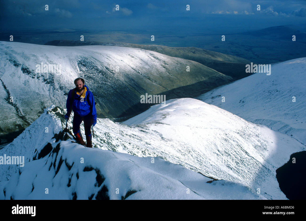 Winter mountaineering on Sharp Edge on Blencathra in England's Lake ...