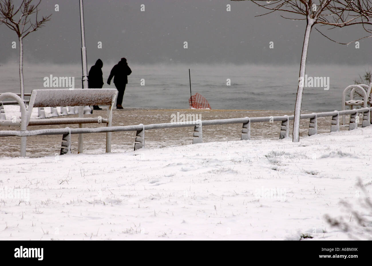 Walking through snow by the sea in Alimos, Attica, Athens Greece Stock ...