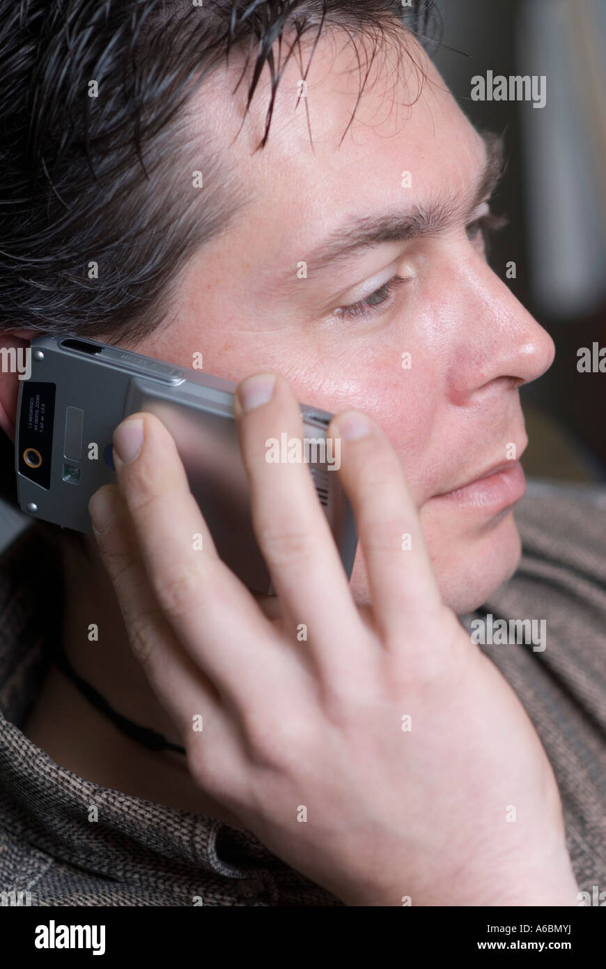 Man talking on a cell phone Stock Photo - Alamy