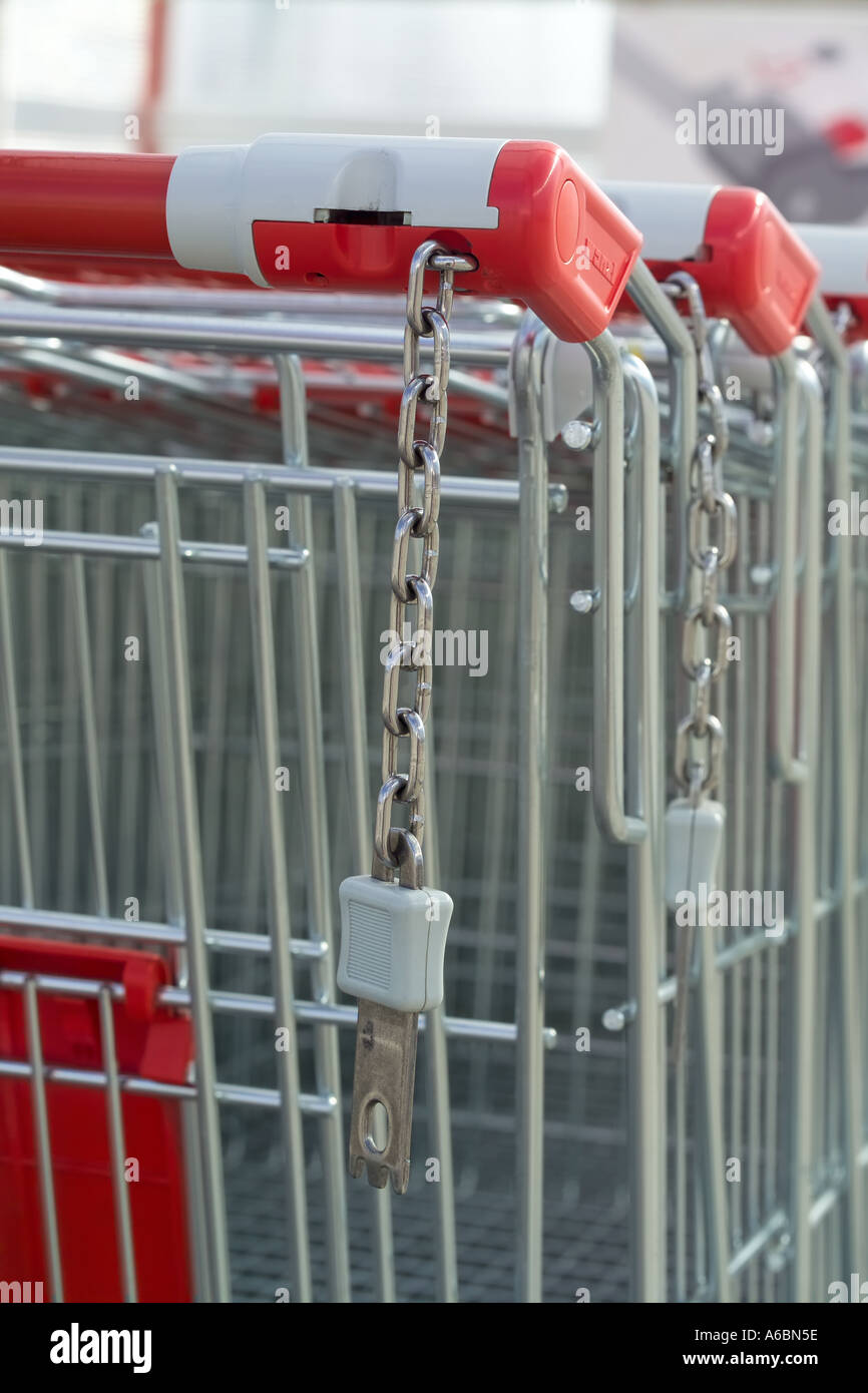 Shopping trolleys chained together hi-res stock photography and images ...