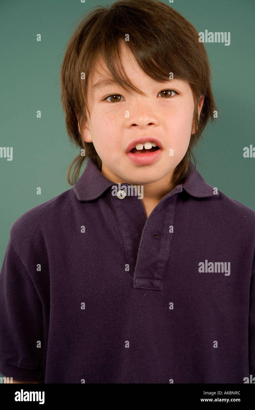 Portrait of Asian boy looking surprised Stock Photo - Alamy