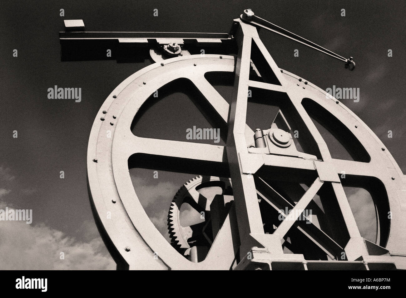 SMALL COG, BIG WHEEL. Huge industrial wheel and cog mechanism, on the ...