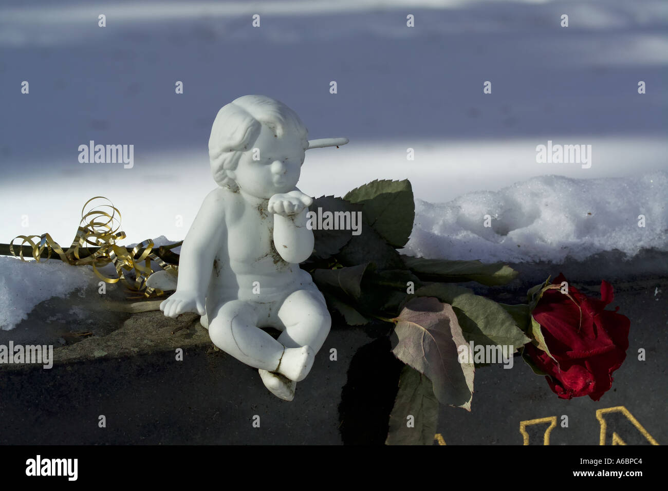 small angel statue on a grave Stock Photo - Alamy