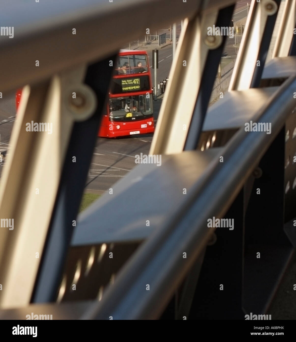 Front of a moving bus, shot above from a bridge - framed by the ...