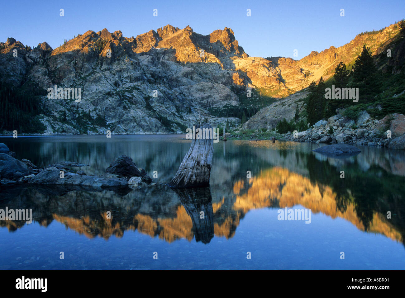 The Sierra Buttes tower over Upper Sardine Lake in Tahoe National ...