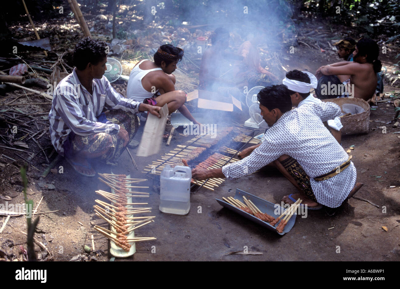 Men preparing food for the ritual blessing of a new temple, Ubud, Bali ...