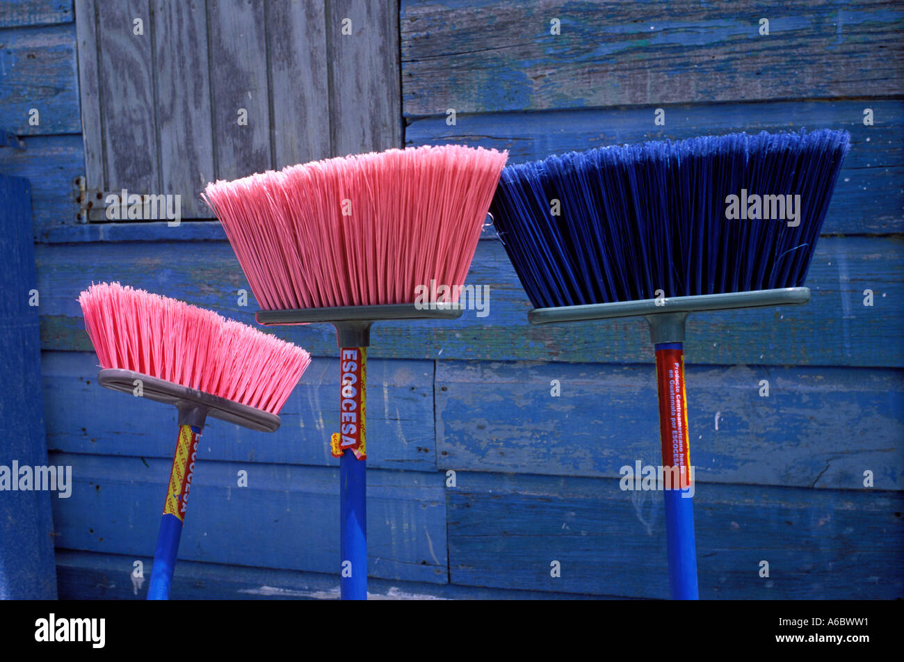 Three colorful Brooms for sale at a General Store in San Pedro ...