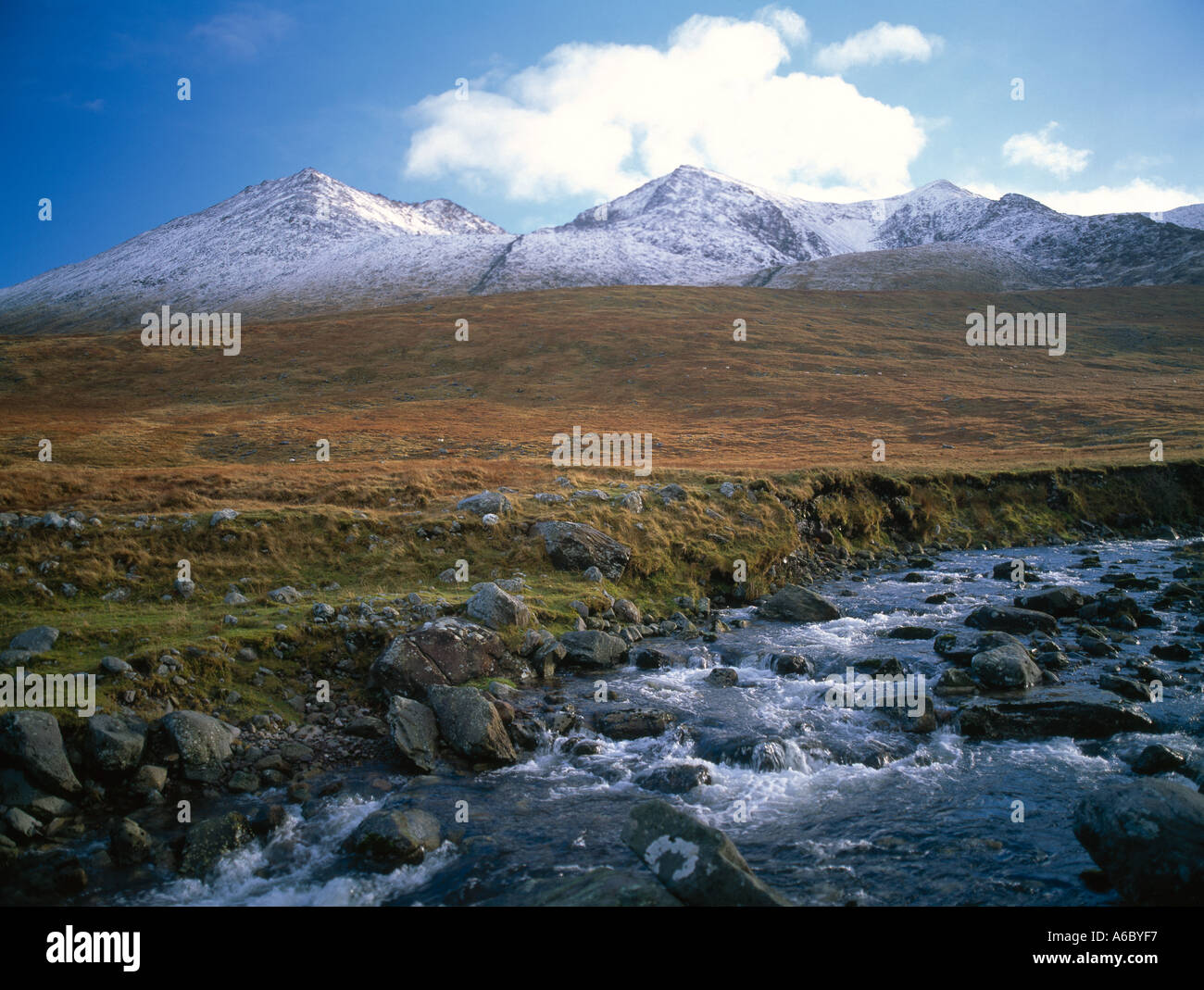 fresh water stream rolling down hillside from irelands highest mountain ...