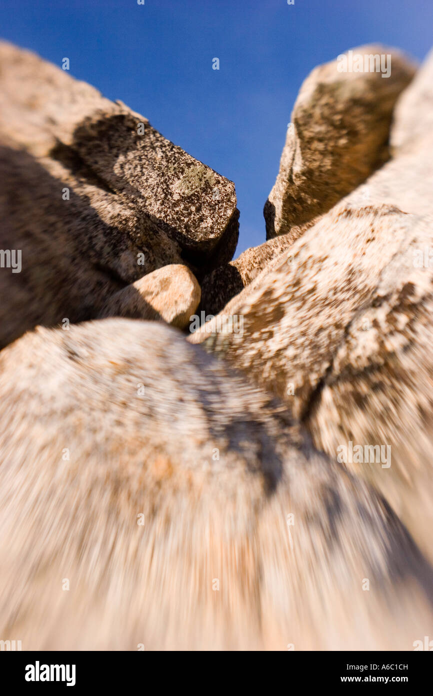 Stock photo looking up at a pile of large boulders, seen against a ...