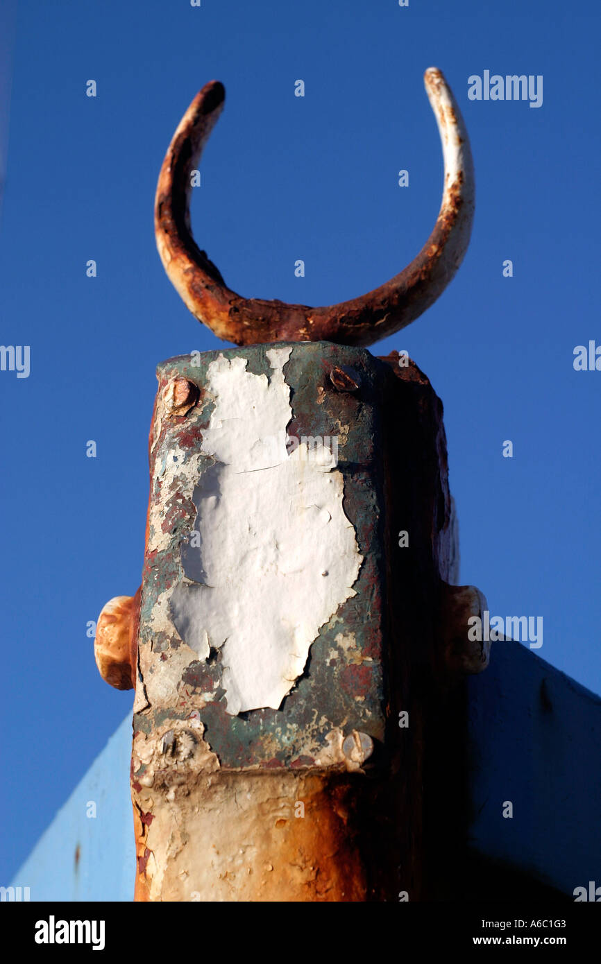rowing oar lock cleat thing on old boat Stock Photo - Alamy