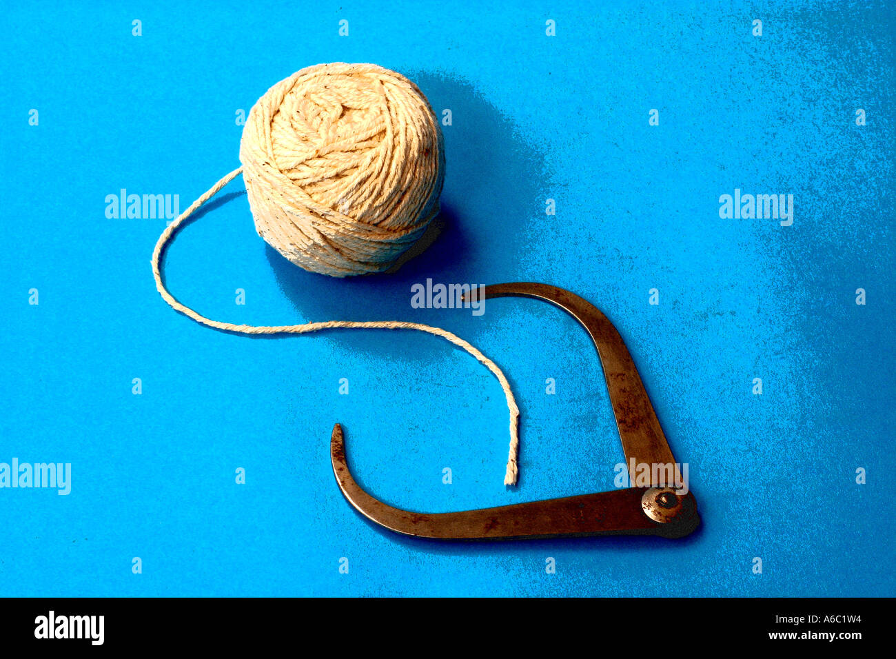 Ball of string with engineers measuring calipers Stock Photo - Alamy