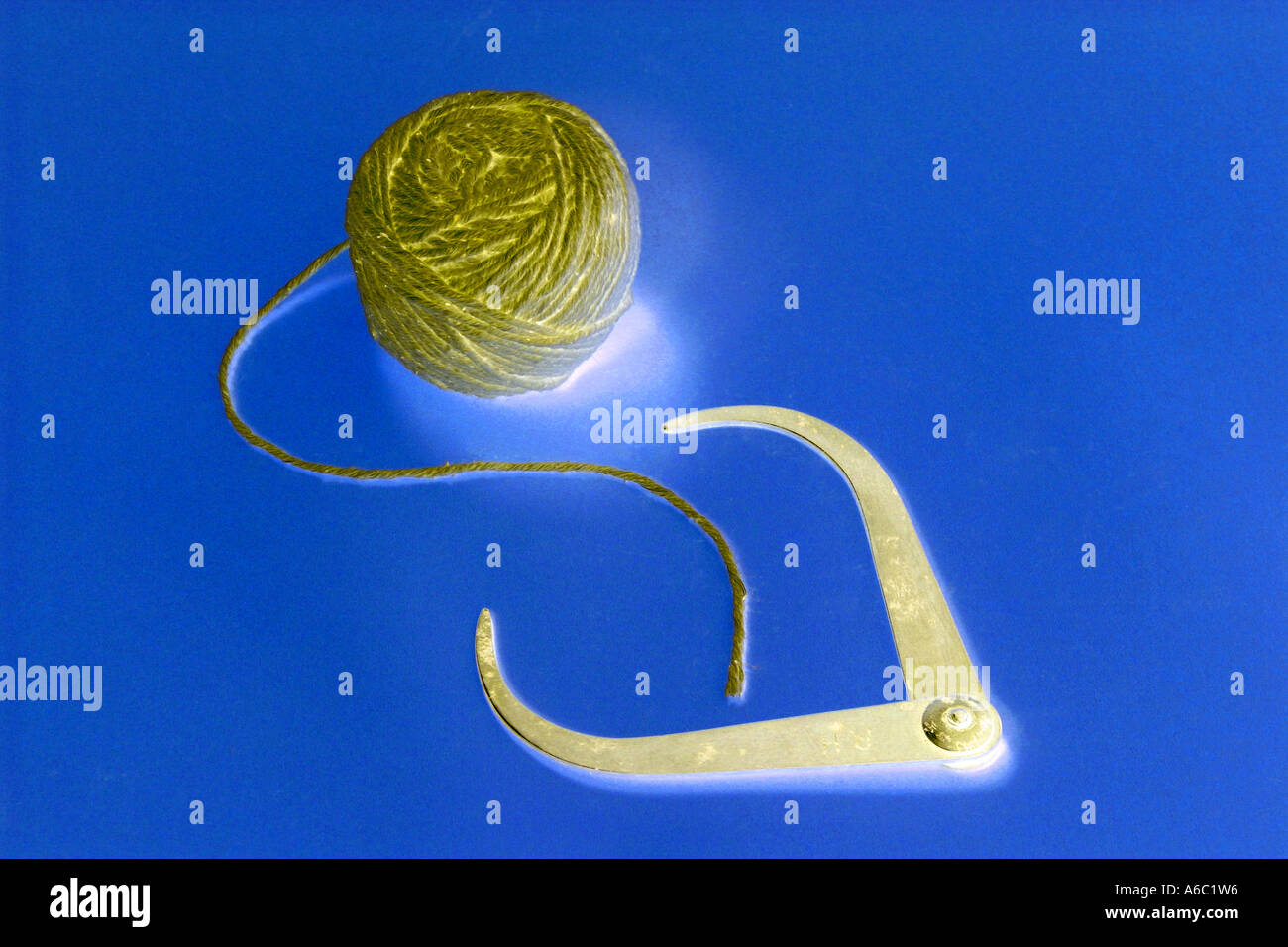 Ball of string with engineers measuring calipers Stock Photo - Alamy