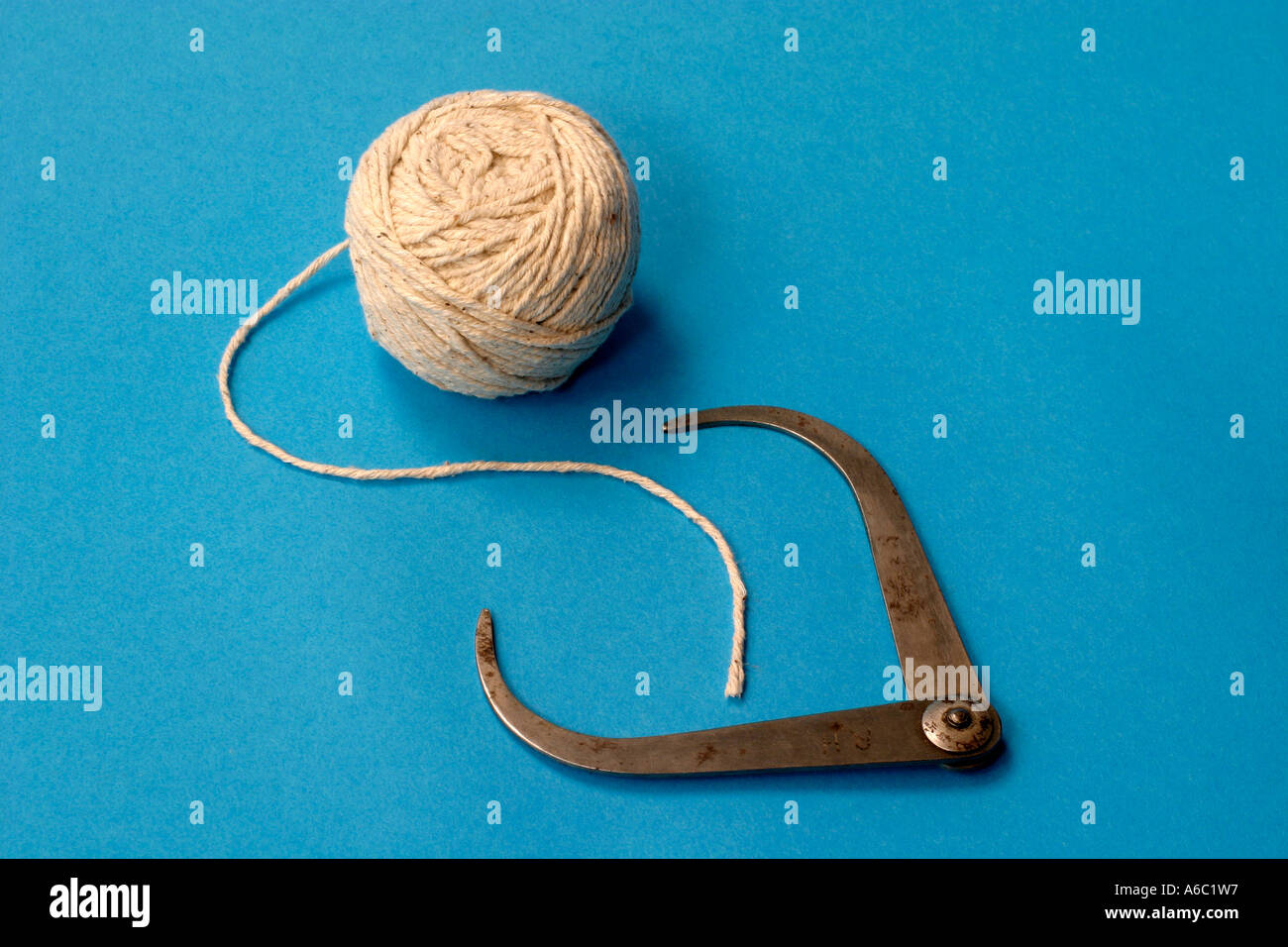 Ball of string with engineers measuring calipers Stock Photo - Alamy