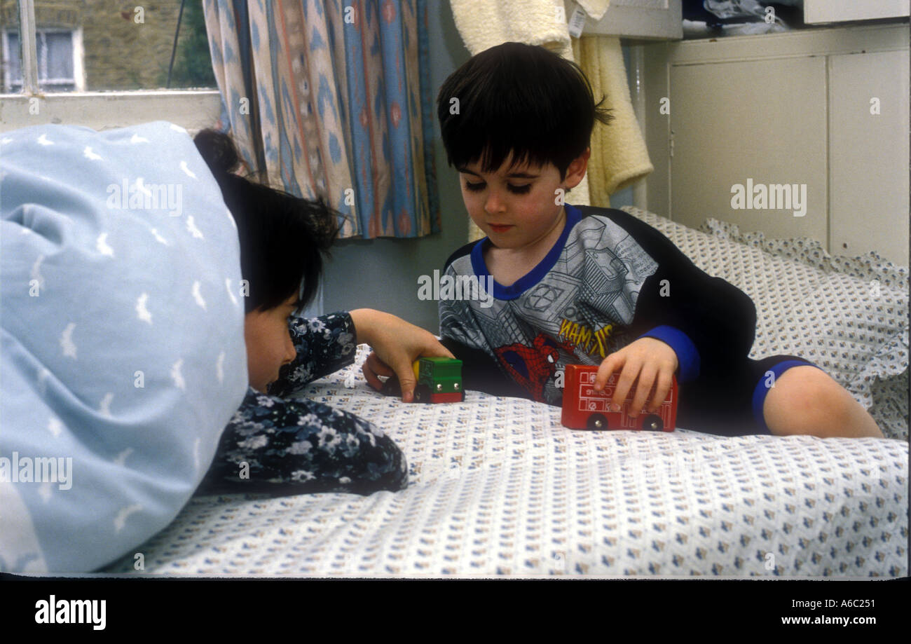 Sister and brother playing before bedtime Stock Photo - Alamy