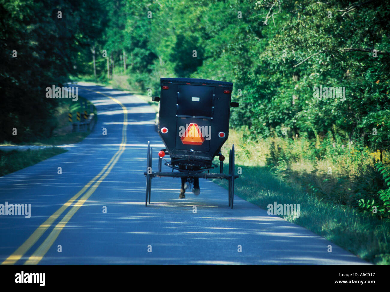 Amish carriage with one horse on highway in mid America in the Midwest ...