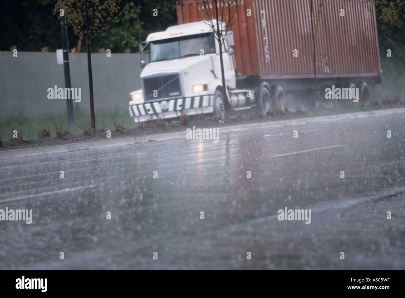 Truck in heavy rain Stock Photo - Alamy