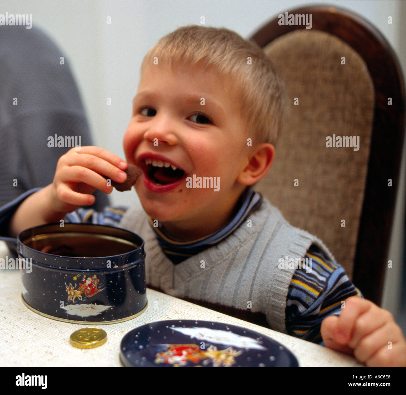 Boy eating biscuit in hi-res stock photography and images - Alamy