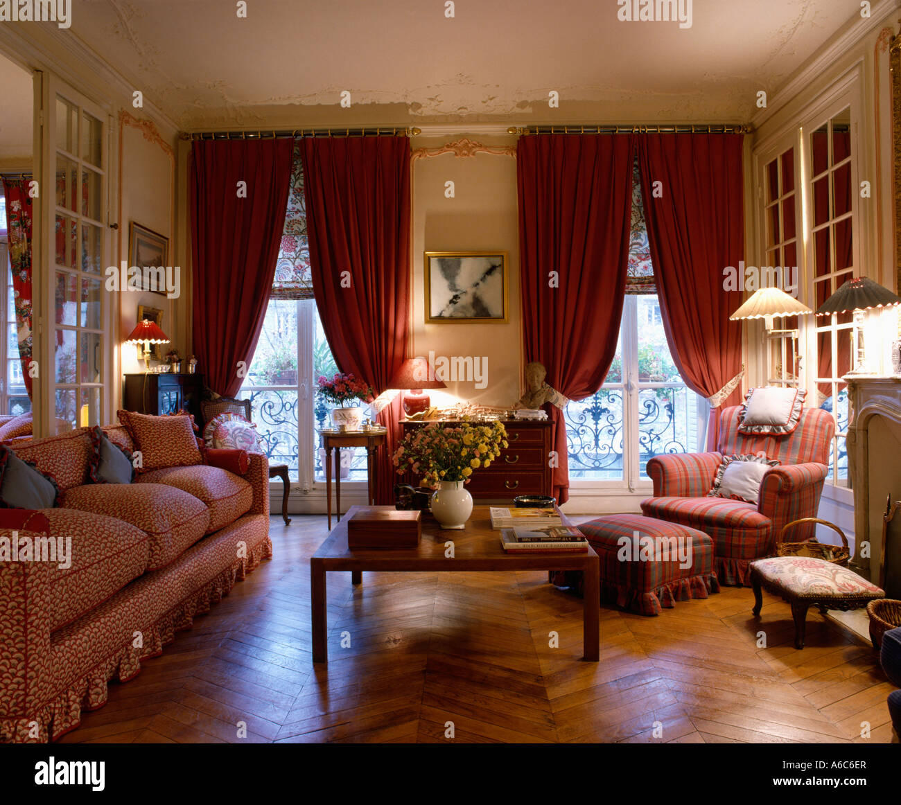 French windows with red drapes in traditional sittingroom with red ...