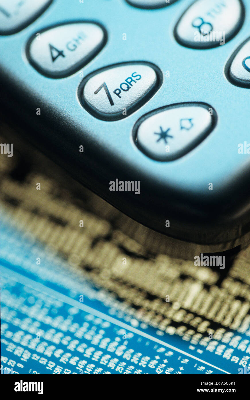 Cellphone and stock quote pages Stock Photo - Alamy