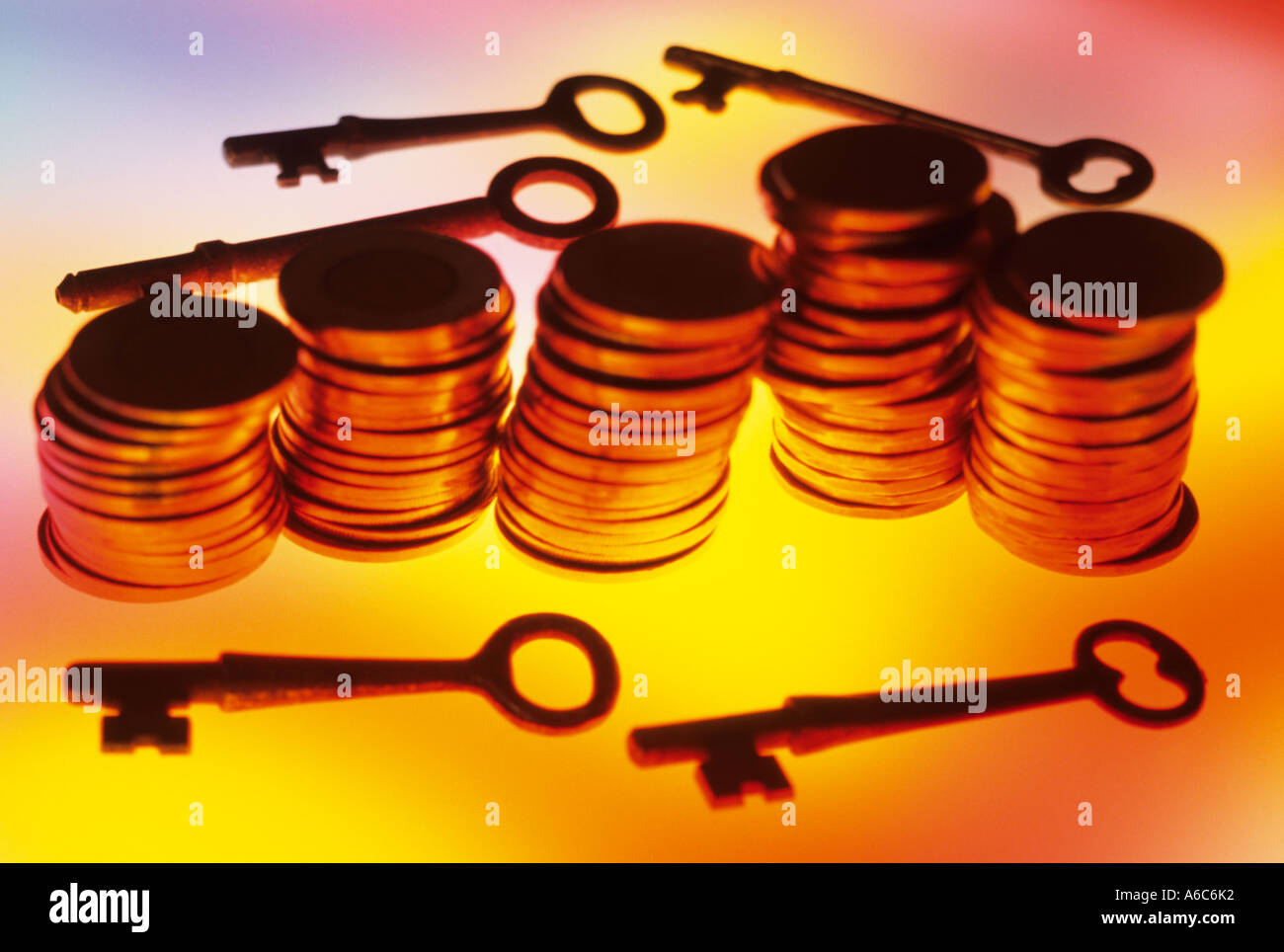 Coin stacks and keys Stock Photo - Alamy