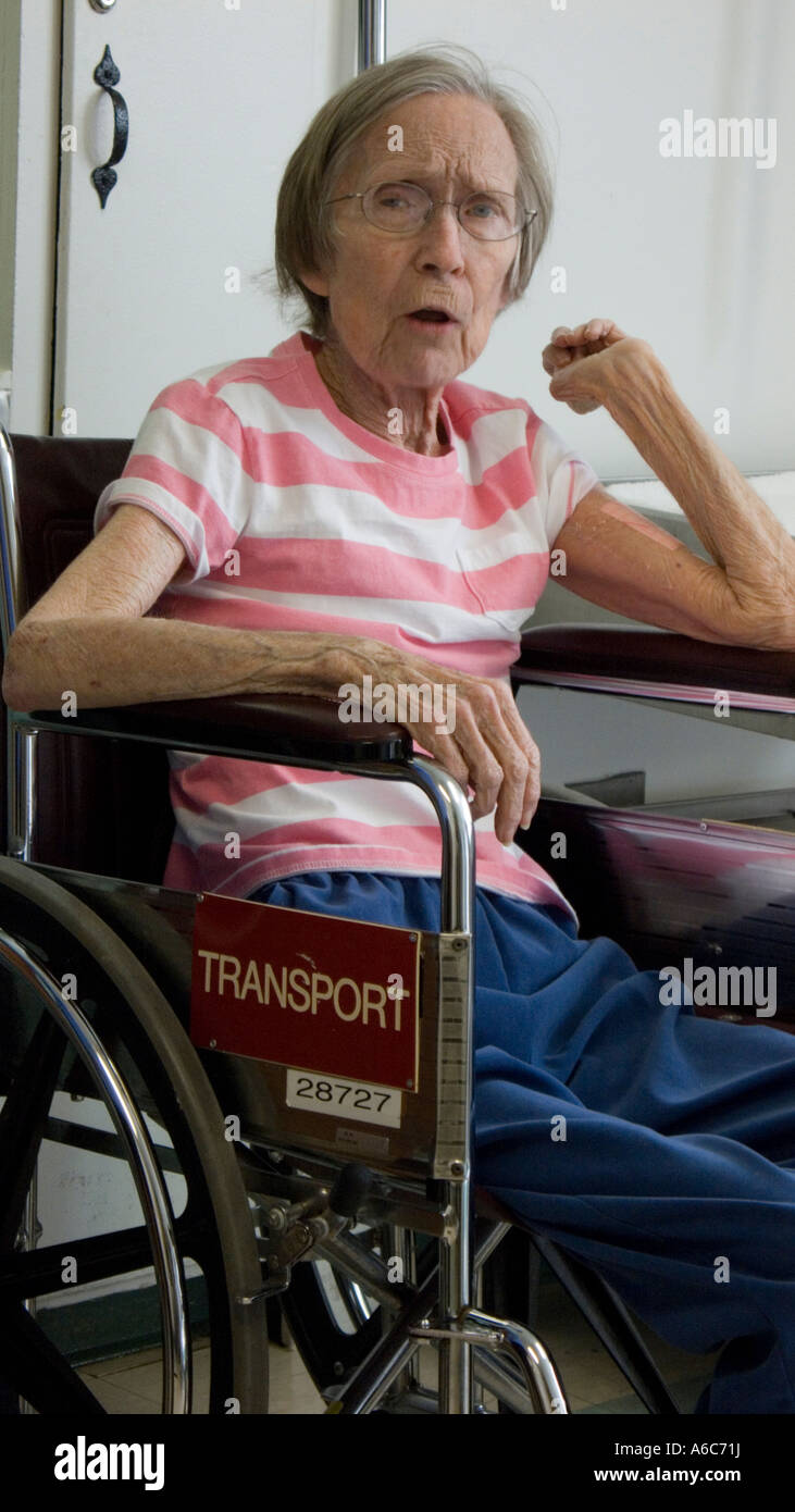 irritated 80 year old woman resting after a whirlpool wound treatment ...